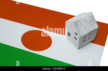 Small house on a flag - Niger Stock Photo - Alamy