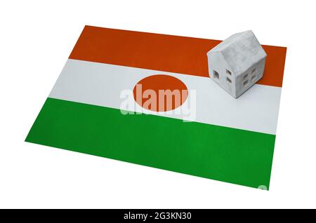 Small house on a flag - Niger Stock Photo - Alamy