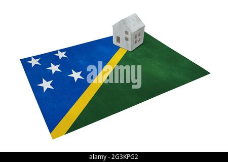 Small house on a flag - Solomon Islands Stock Photo - Alamy