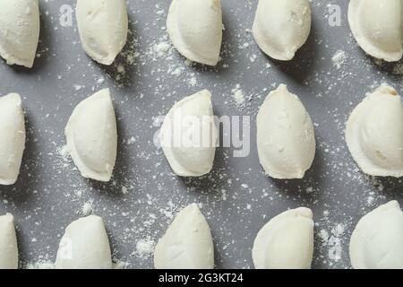 Concept of cooking vareniki or pierogi on white wooden table Stock ...
