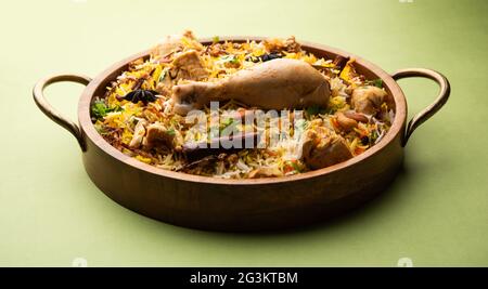 Restaurant style Spicy Chicken Biryani served with Raita and Salan ...