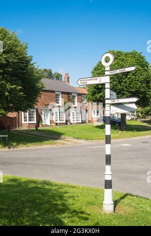 Old cast iron road signs in a small Shropshire village UK Stock Photo ...