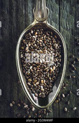Chia seeds with a wooden spoon close up Stock Photo - Alamy