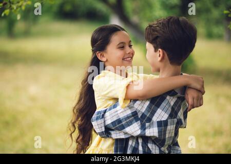 Little kids hugging Stock Photo - Alamy