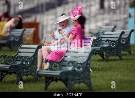Racegoers on a bench during day one of Royal Ascot at Ascot Racecourse ...