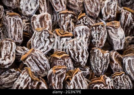 Persimmon dry in the sun as a dry fruit Stock Photo - Alamy