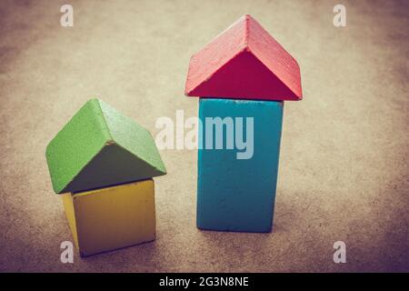 House shape formed out of building blocks on a brown background Stock ...