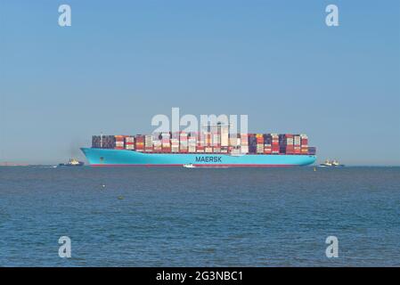 Container ship Estelle Maersk assisted by three tugs entering the Port ...