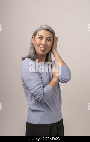Studio shot of cheerful senior Chinese couple Stock Photo - Alamy