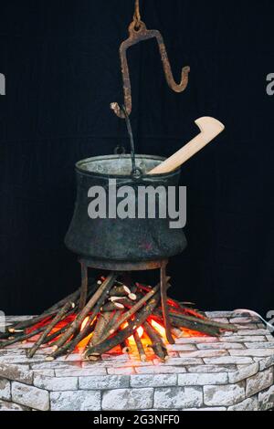 Retro style old metal cauldron item in view Stock Photo - Alamy