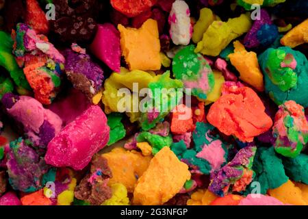 Dry colorful play dough in smal pieces Stock Photo - Alamy
