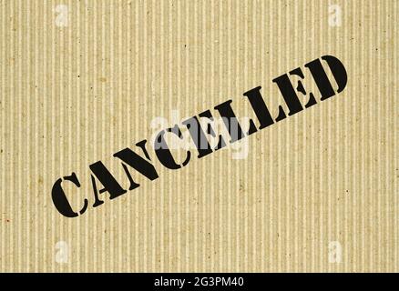 Cancelled label written on brown corrugated cardboard Stock Photo - Alamy