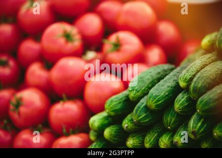 Tomatoes and cucumbers close up. ripe vegetables. healthy vegetarian ...