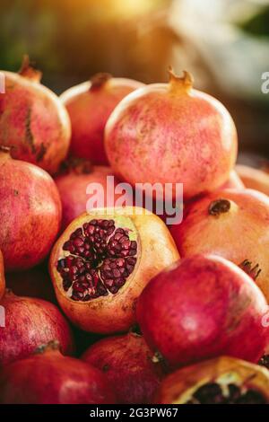 Ripe pomegranates close up, selective focus. Red pomegranate fruits on ...