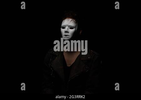 Actor wearing a face mask while acting on a dark stage Stock Photo - Alamy