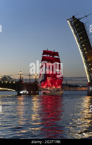 Brig with scarlet sails in the water area of the Neva. Rehearsal of the ...