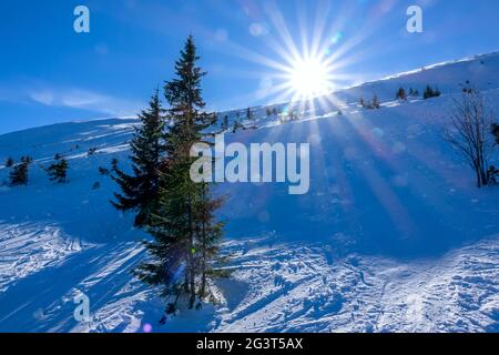 Bright Sun over an Unequipped Ski Slope and Chair Lift Stock Photo - Alamy