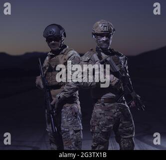 Soldiers squad in night mission Stock Photo - Alamy