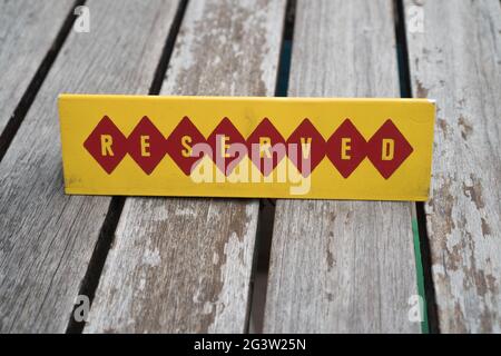 Wooden reserved sign on the table Stock Photo - Alamy