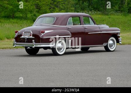 A three-quarter-rear view of a 1949 Chrysler Windsor four-door sedan ...