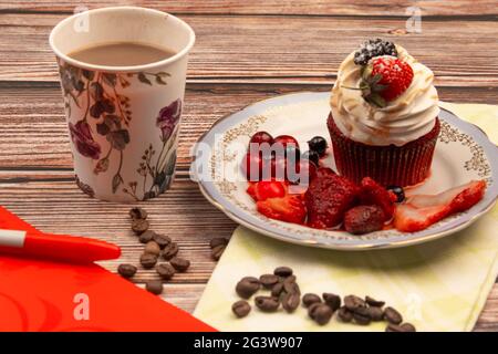 food photo on wooden background cupcake with berries and coffee ...
