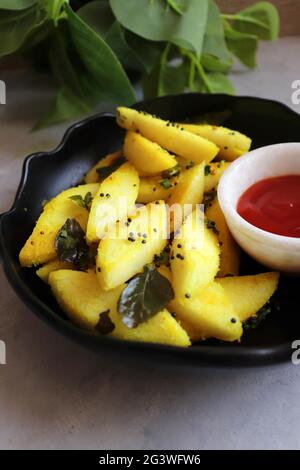 South Indian food idli pieces and sambar Stock Photo - Alamy