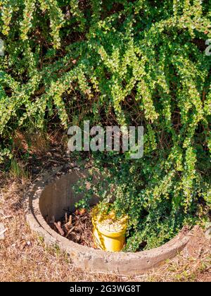 Yellow safety cap on concrete background top view Stock Photo - Alamy