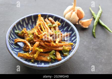 Dry Bombay duck fried with chili and garlic. Dried Bombay duck masala ...