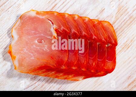 Image of a dried pork tenderloin Lomo embuchado with greens Stock Photo ...
