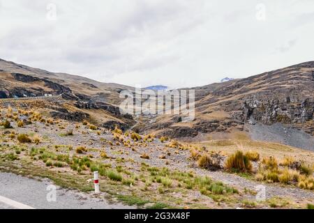 View of arid mountains, wonderful cloudy landscape with dry grasses in ...