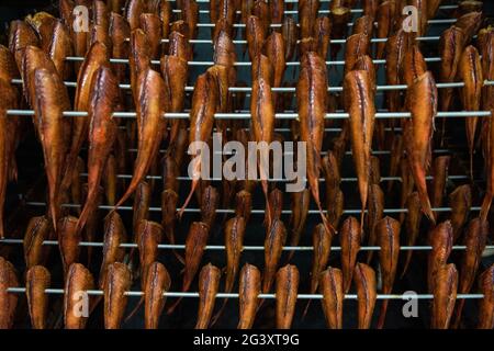 Smoked fish production concept Stock Photo - Alamy