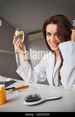 Photo of cute millennial brunette lady drink cocktail index promo wear ...