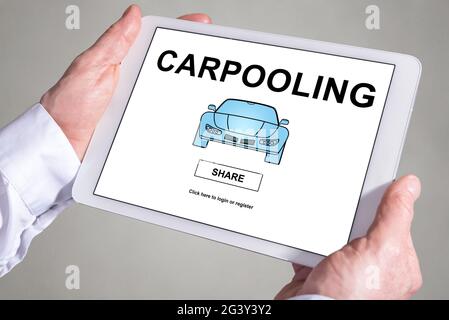 Tablet screen displaying a carpooling concept Stock Photo - Alamy
