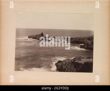 View of a bridge between rocks, presumably on the coast at Monaco, c ...