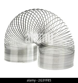 Metal Slinky spring toy on white background Stock Photo - Alamy