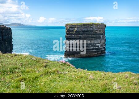 Beautiful sea stack Downpatrick Head, with rock layers of millennia of ...