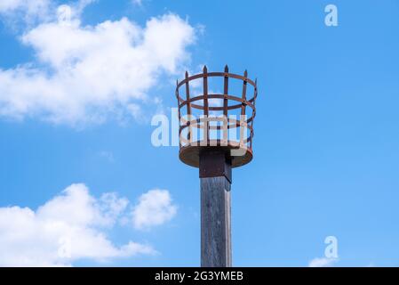 Metal basket fire beacon on pole Stock Photo - Alamy