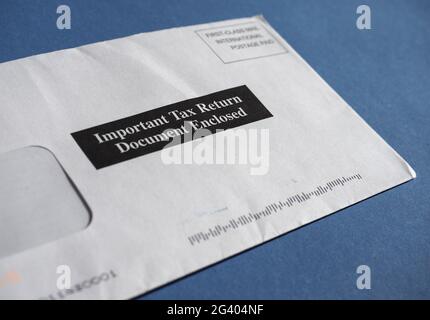 Envelope with important tax return document enclosed Stock Photo - Alamy