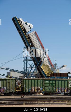 hydraulic lift called a "truck tipper" is used to unload wood chips at ...