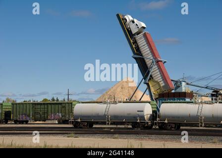 hydraulic lift called a "truck tipper" is used to unload wood chips at ...