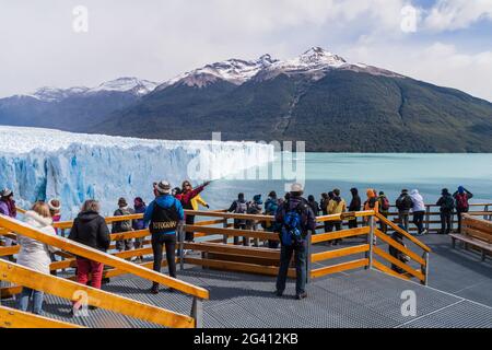 PERITO MORENO, ARGENTINA - MARCH 10, 2015: Tourists on boardwalks ...
