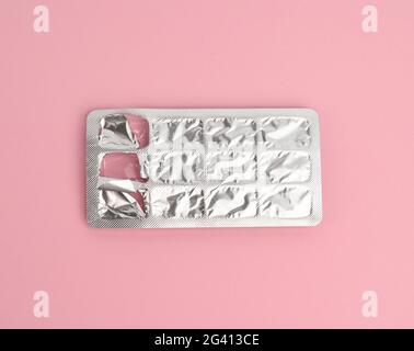 blank blister pack of capsule pills on a yellow background, top view ...