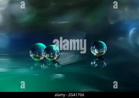 Big water drops, 3d balls on a blurry background with light effects and ...