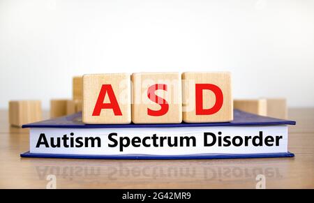 ASD, autism spectrum disorder symbol. Books with words 'ASD, autism ...