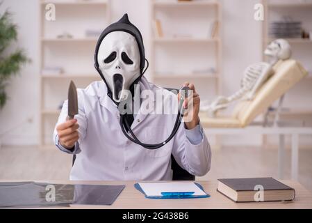 Devil doctor working at the hospital Stock Photo - Alamy