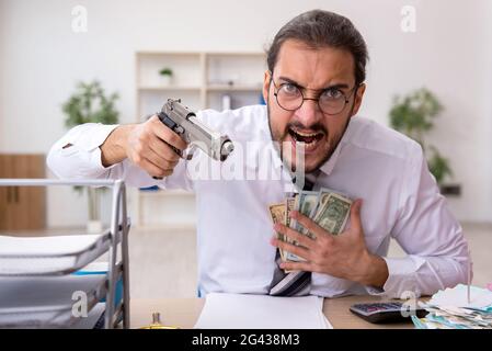 Angry bookkeeper in bankruptcy concept Stock Photo - Alamy
