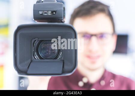 Professional film production: Male filmmaker is recording with a ...