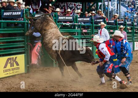 Jace Trosclair climbs to safety in the background while the ...