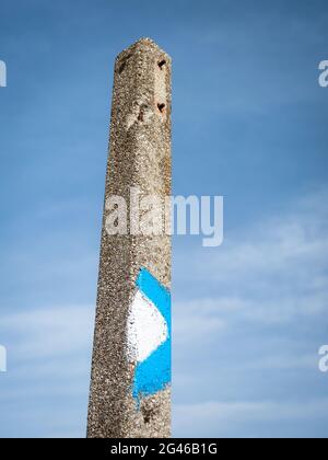 Post bollard of concrete with blue sky Stock Photo - Alamy