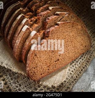 Rye bread on napkin on wooden background Stock Photo - Alamy